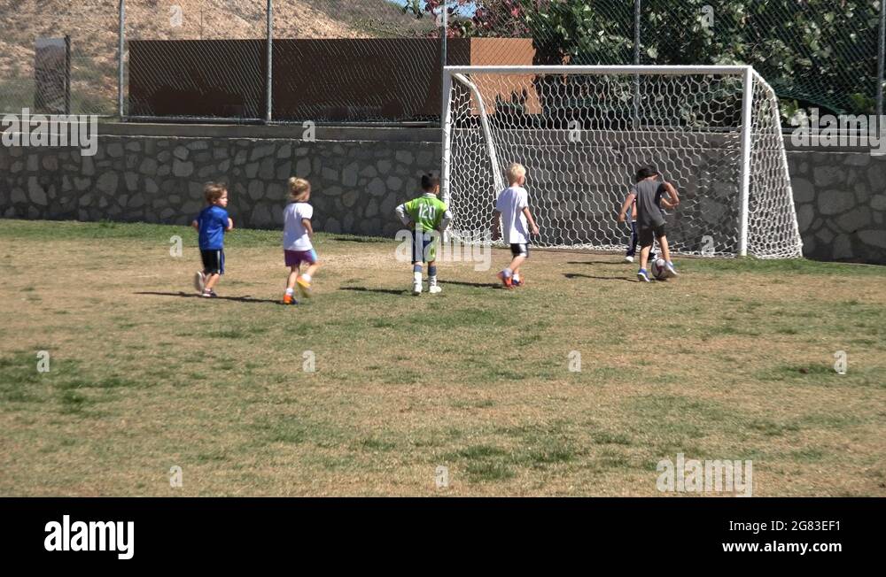 Children playing football field Stock Videos & Footage - HD and 4K ...