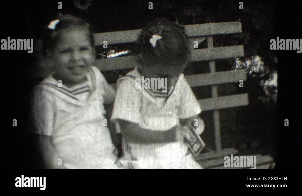 LEVITTOWN NEW YORK-1942: Young Children Playing Joyfully On Park Bench With Each Stock Video ...