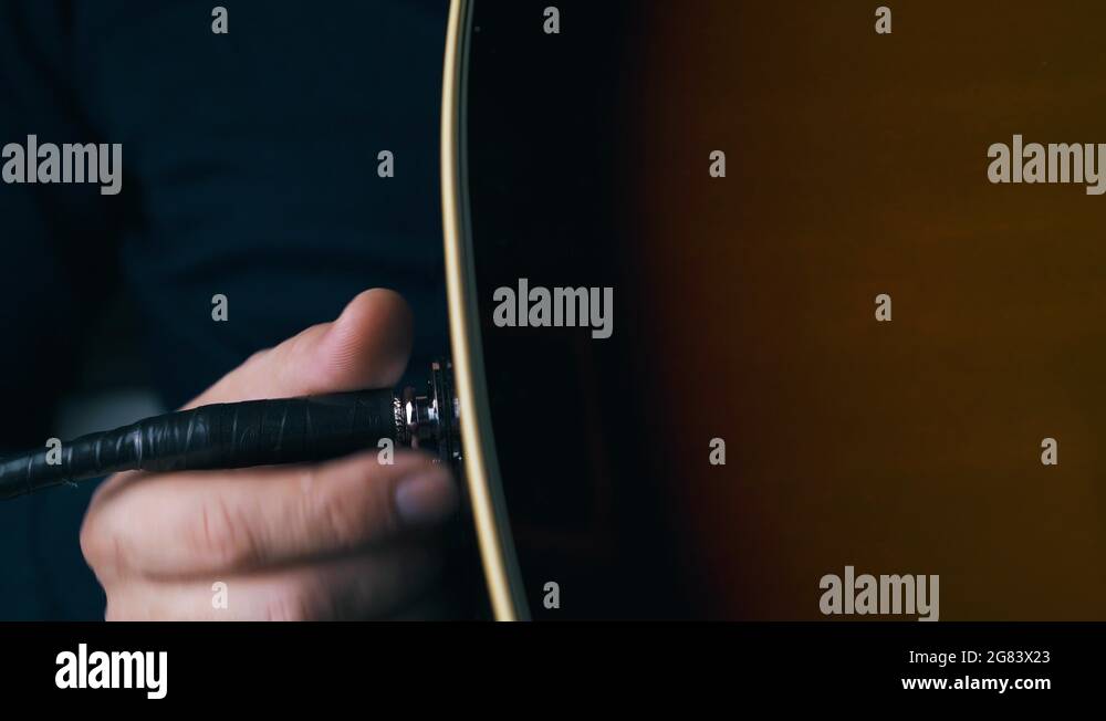 musician takes off quarter-inch jack from acoustic guitar Stock Video ...