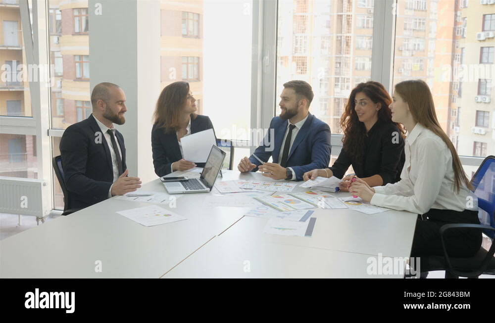 Office workers, employees of a large company, two young men and three ...