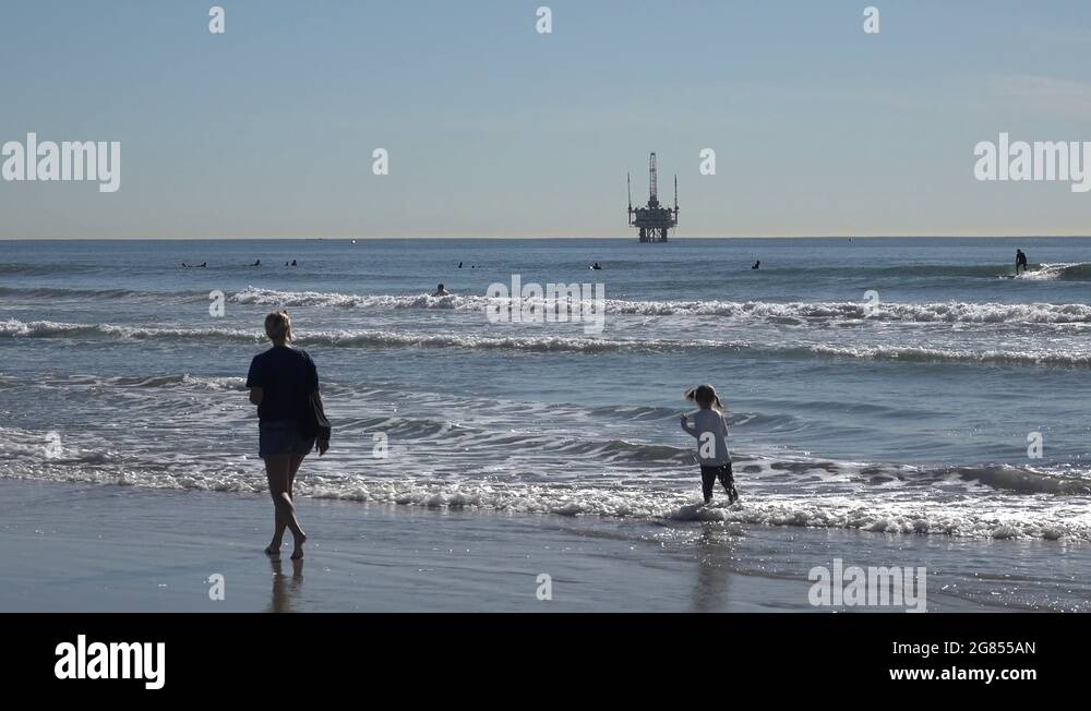 HUNTINGTON BEACH CALIFORNIA-2020: Child Jumping Happily On The Beach ...