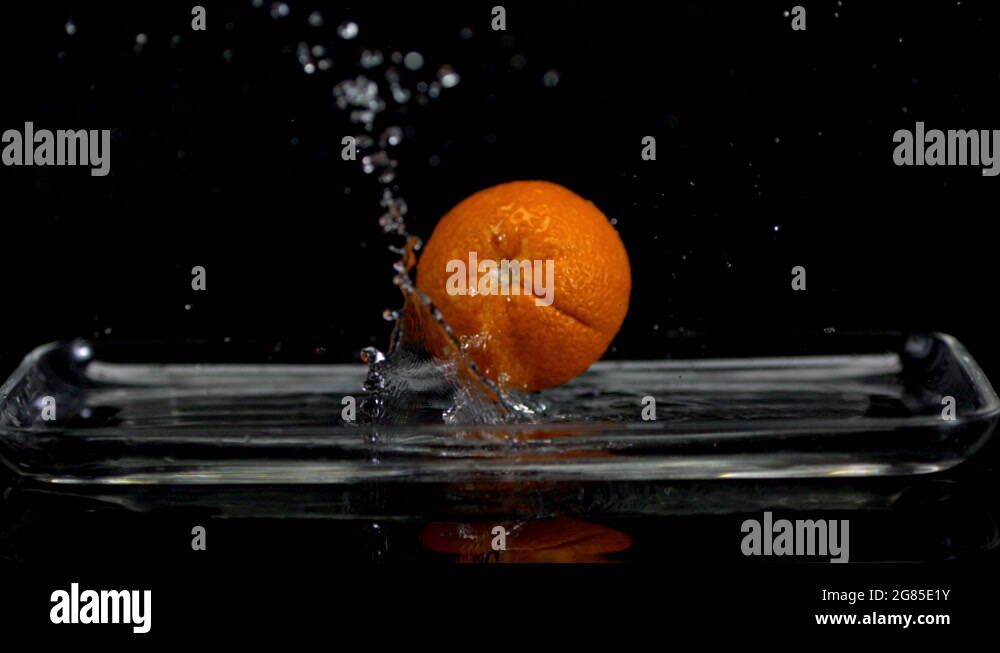 4K Super 1000 FPS Super Slow-Mo Of Orange Falling In Tray With Water ...