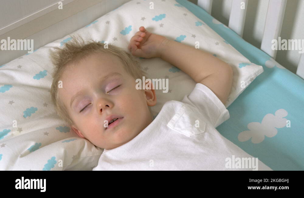 Cute baby boy is sleeping in daytime Stock Video Footage - Alamy
