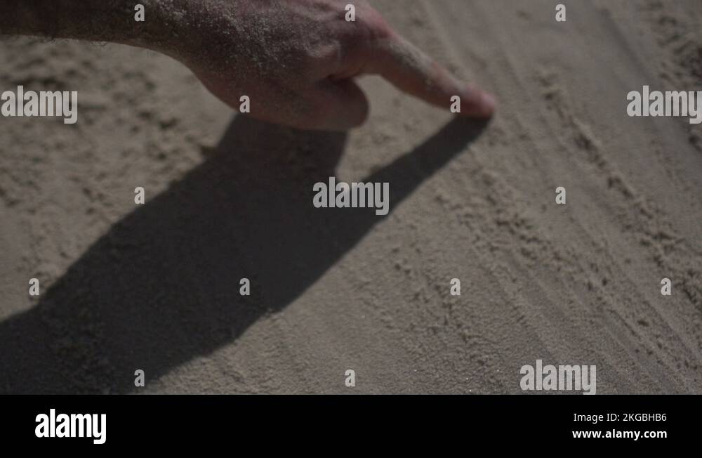 Close up shot on a man hand touching the sand beach. Slow motion real life Stock Video Footage ...