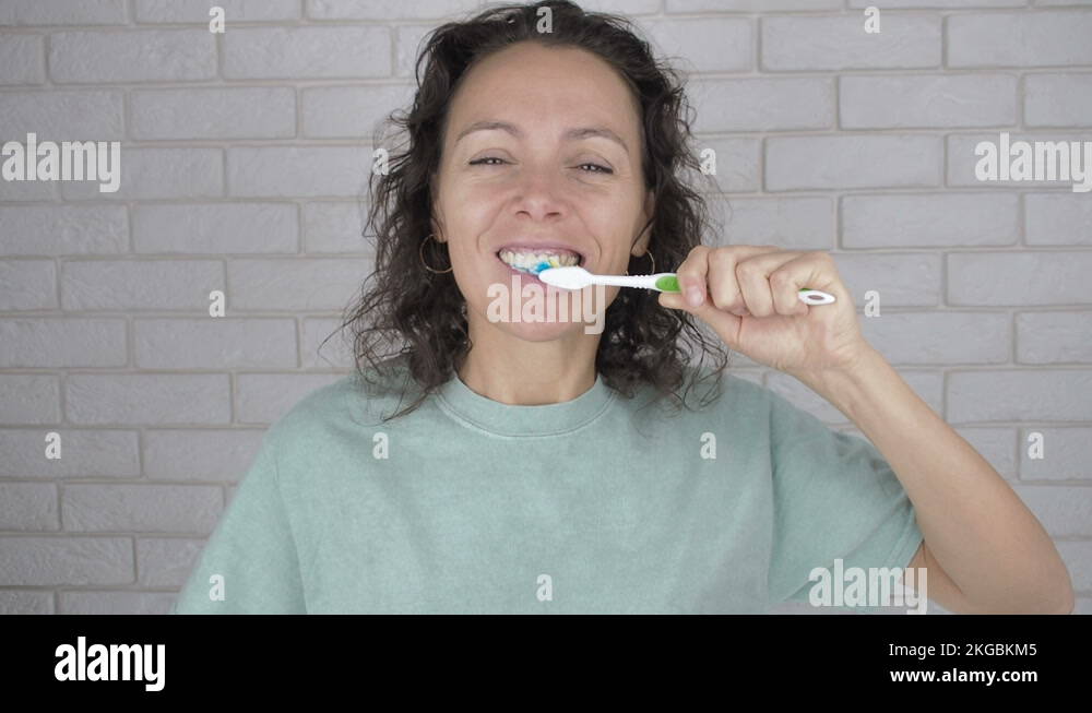 Woman brushing teeth Stock Videos & Footage - HD and 4K Video Clips - Alamy
