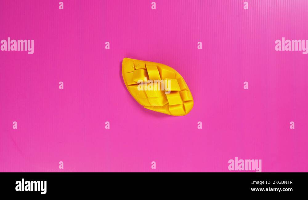 tropical fruit on a bright pink background. Pineapple slices and yellow ...