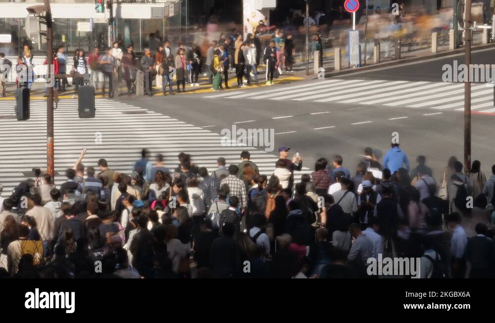 Crowd of people walking on busy city street at rush hour time. 4K time ...