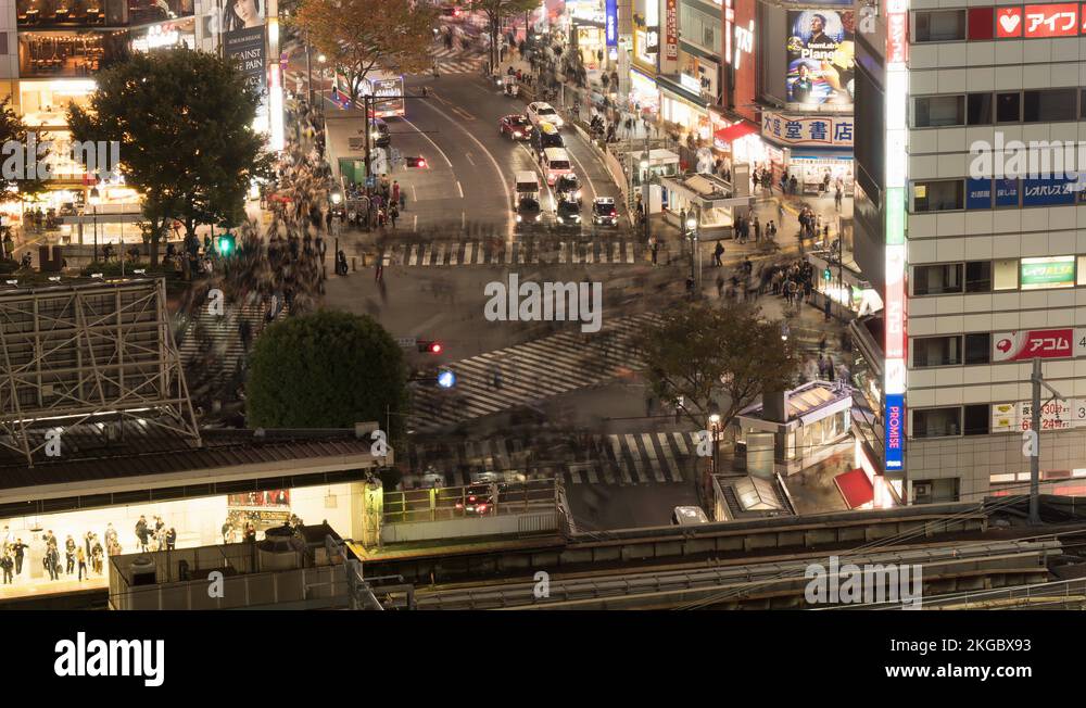 People and vehicles cross the famous Shibuya intersection, 4K time ...