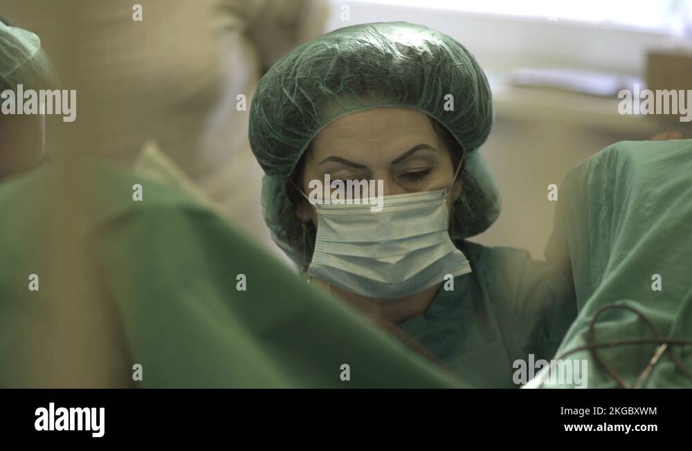 Female surgeon stitching wound Stock Videos & Footage - HD and 4K Video ...