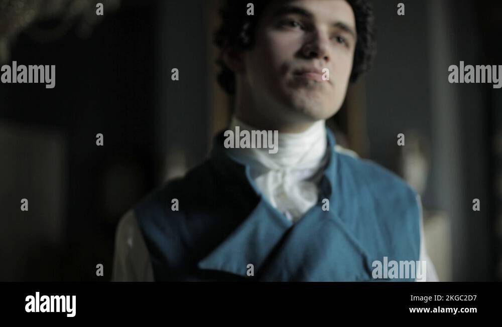 Regency-era man being dressed by another - formal dress, adding coat ...