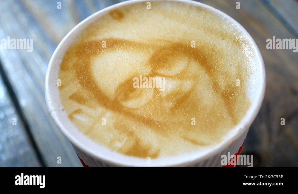 Drawing of a woman's face on a foam coffee latte created by a 3D ...