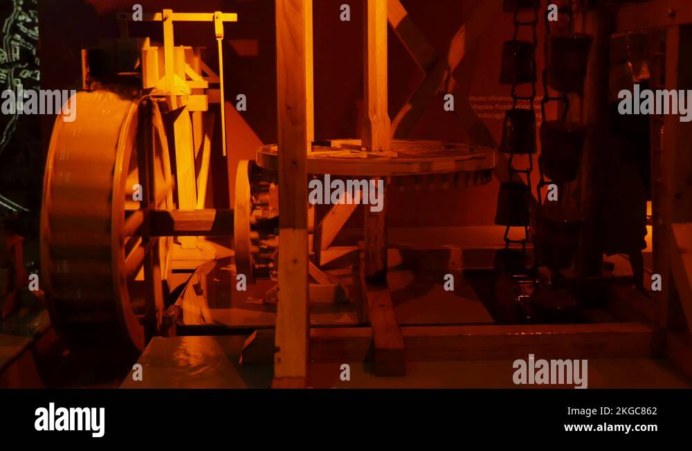 Skillful water mill sample with a rotating wheel, pouring water and ...