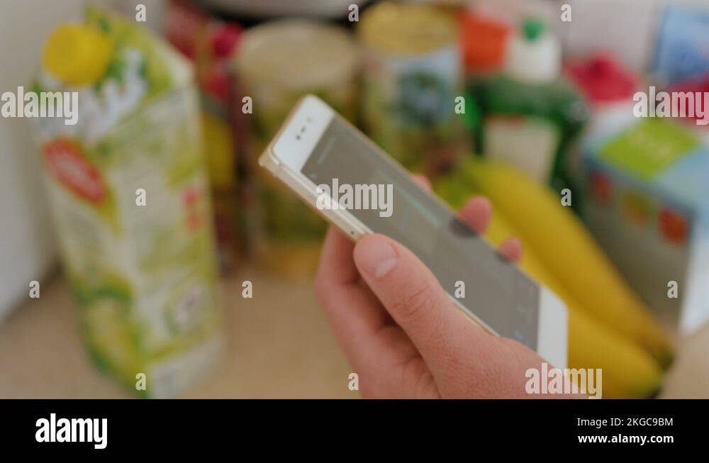 A man scans the QR code on a check on a juice box from a supermarket ...