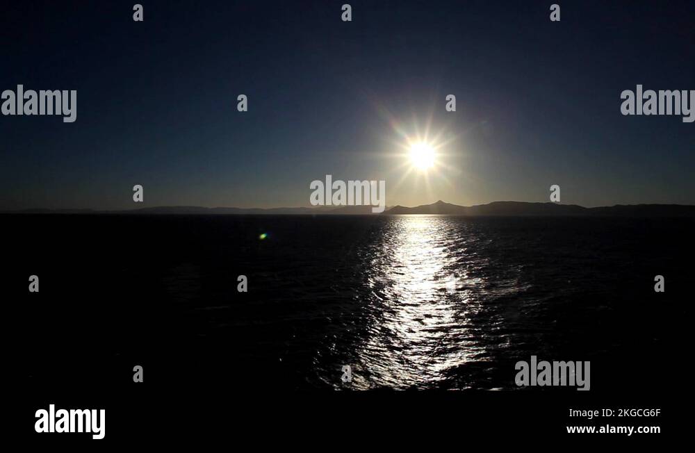 Rays of the setting sun on the coast of an island of Greece Stock Video ...