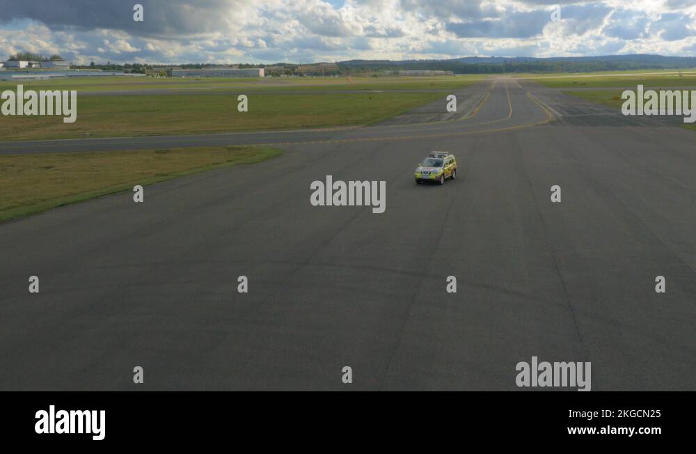 Airport fire crew car driving along runway, drone aerial 4K Stock Video ...