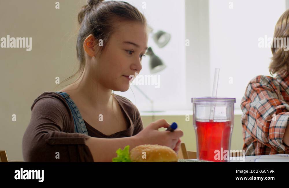 Teenage Students Eating at Lunch Break Stock Video Footage - Alamy