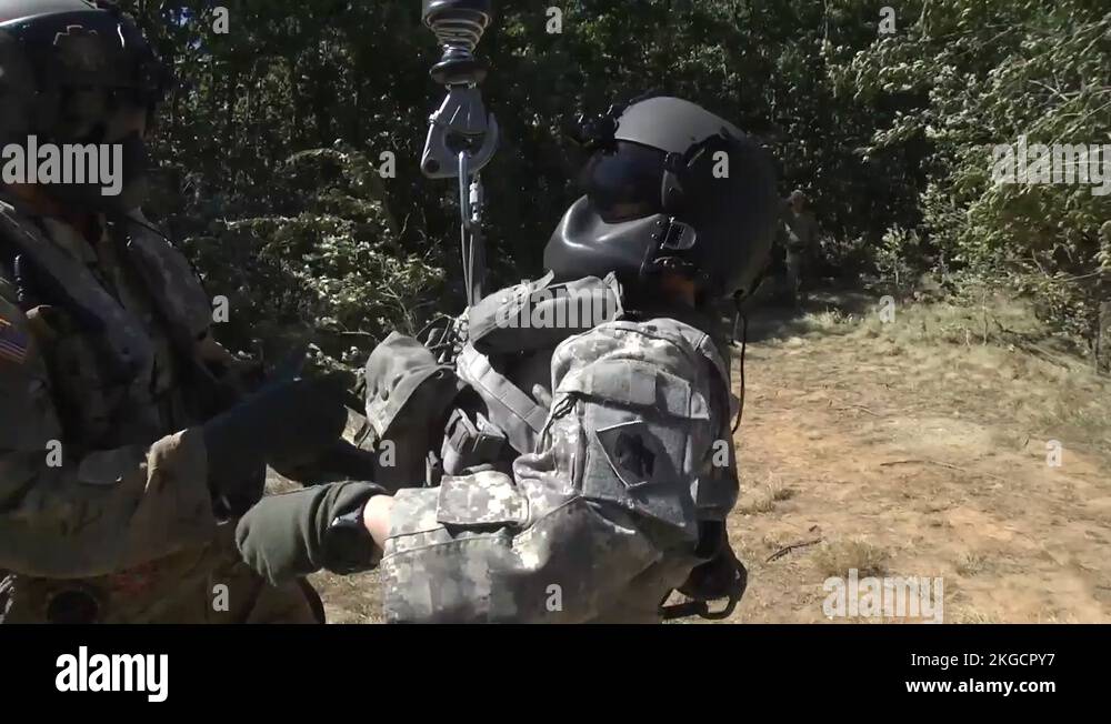 Soldier being lifted by hoist towards UH-60 Black Hawk Stock Video ...