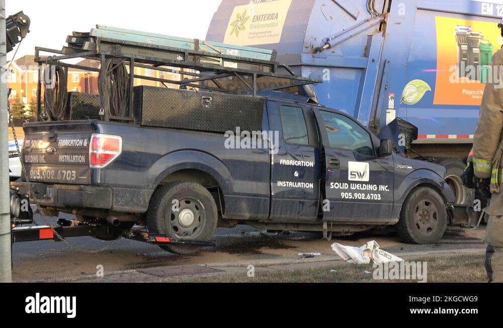 Pickup truck severely damaged after colliding with garbage truck Stock ...