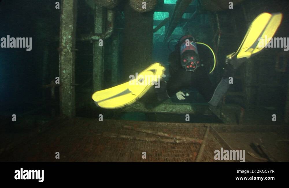 scuba diver underwater exploring the shipwreck underwater ship wreck ...