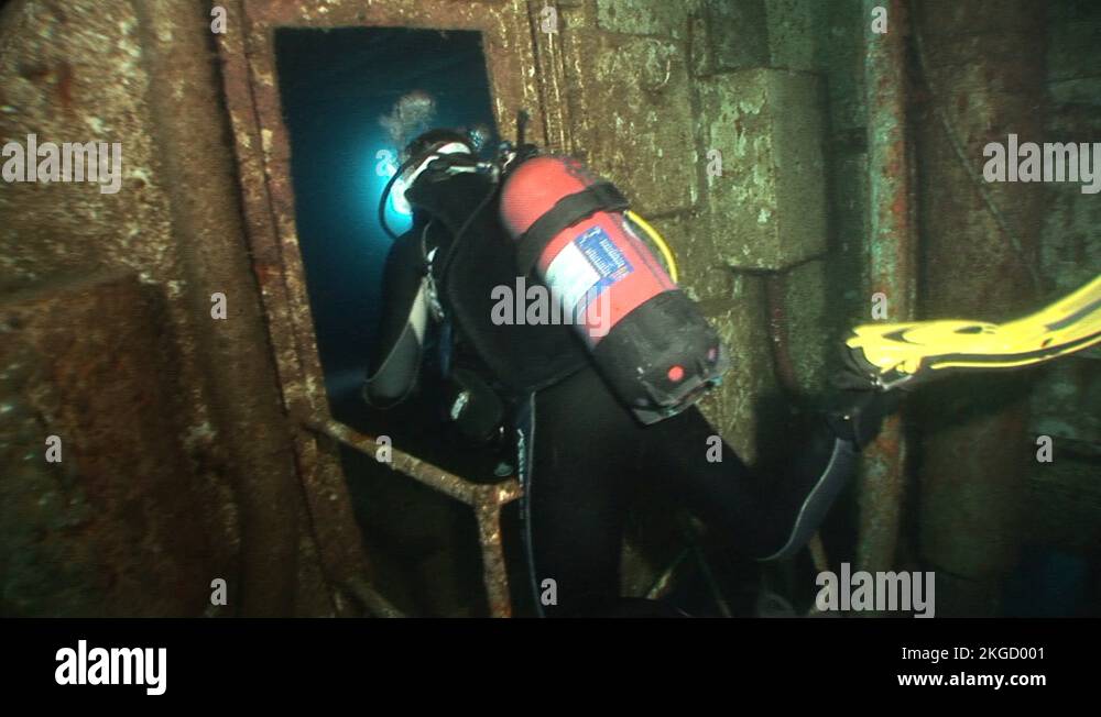 scuba diver underwater exploring the shipwreck underwater ship wreck ...