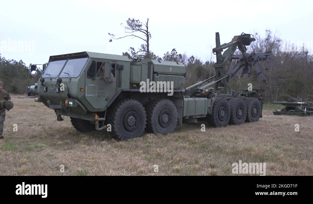 Hydraulic arm being lowered into position on military mobility tactical ...