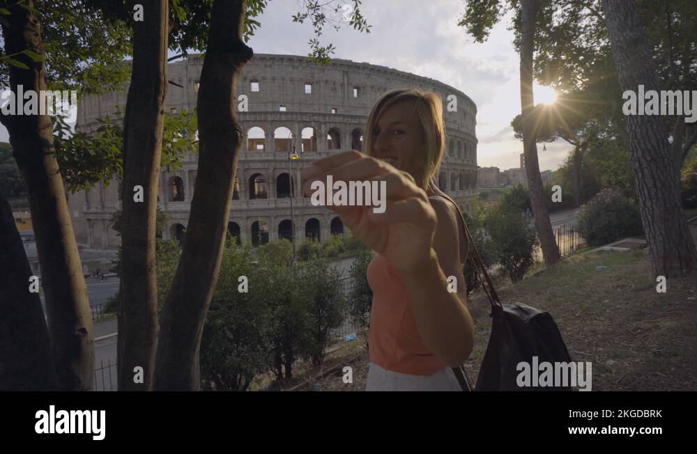 Follow me to Rome; Girlfriend leading boyfriend to the Colosseum ...