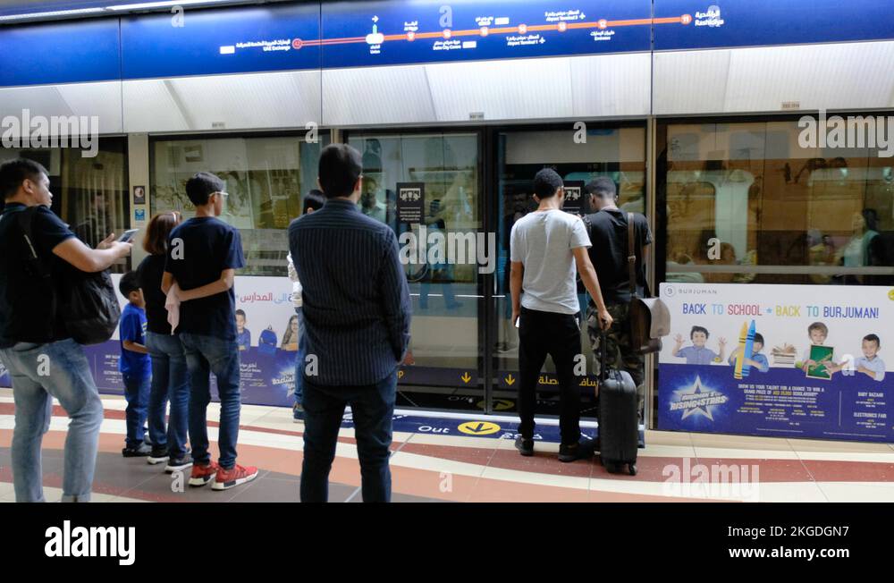 People get out of the electric train at the Dubai Metro station Stock ...