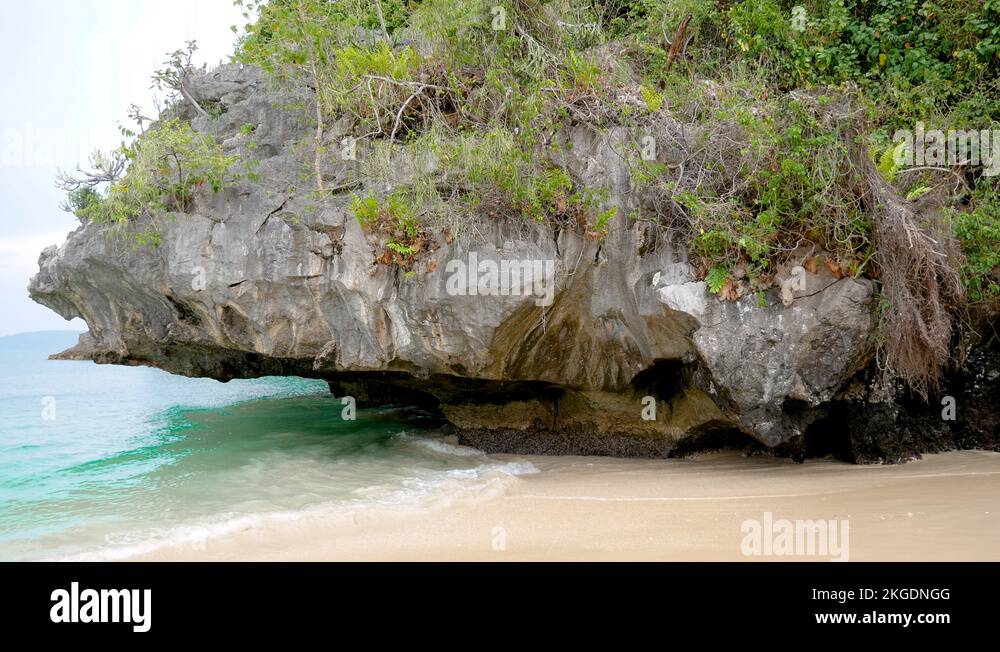 Sea Water Washes The Base Of The Limestone Rock And Slowly Destroys It ...