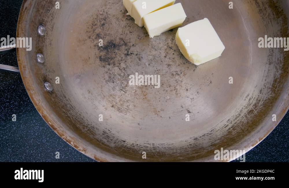 Melting Pats of Butter in a Metal Frying Pan in 4k Stock Video Footage ...