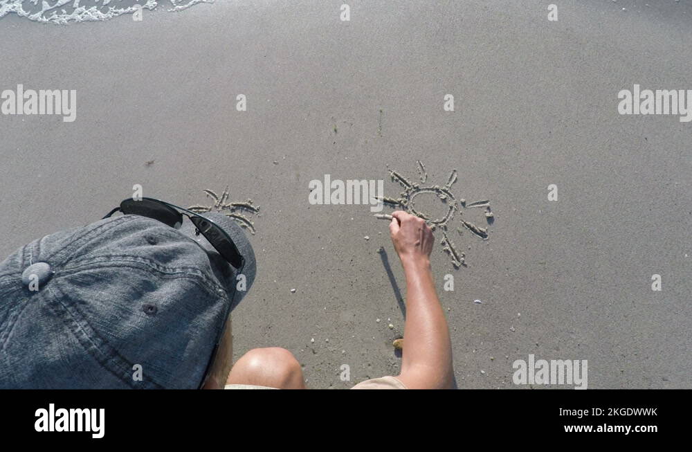 Drawing on sand Stock Videos & Footage - HD and 4K Video Clips - Alamy