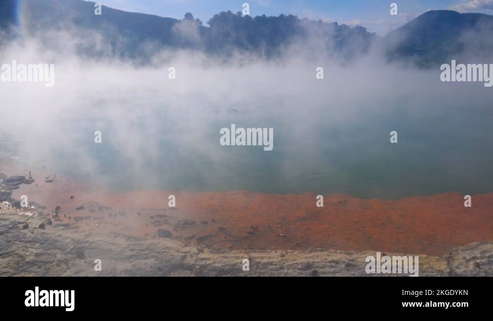 Thick Water Vapor Rising from Geothermal Lake Stock Video Footage - Alamy