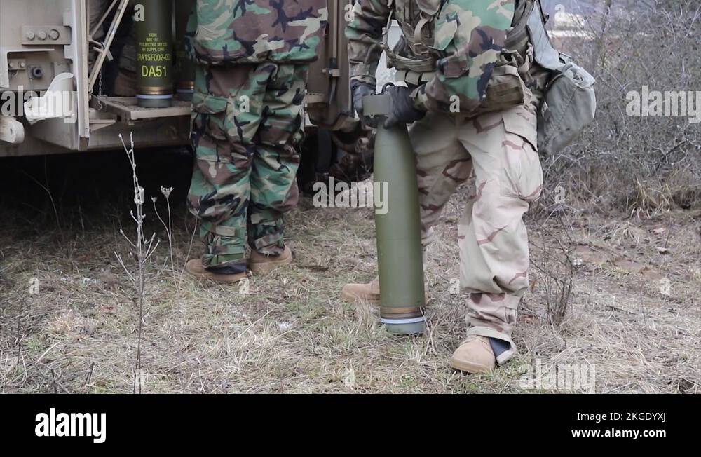 Soldiers unpack and load shells onto battle tank Stock Video Footage ...