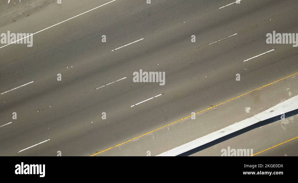 Cars Speeding Down Interstate Highway With Construction Going On Beside