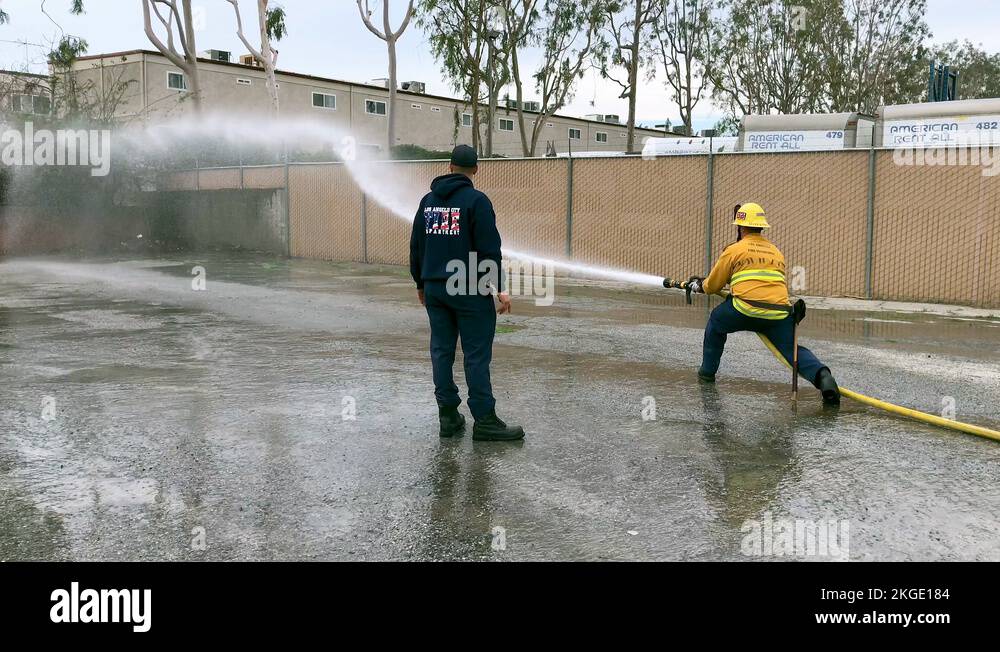 Instructor performing training exercises with firefighters in Los ...