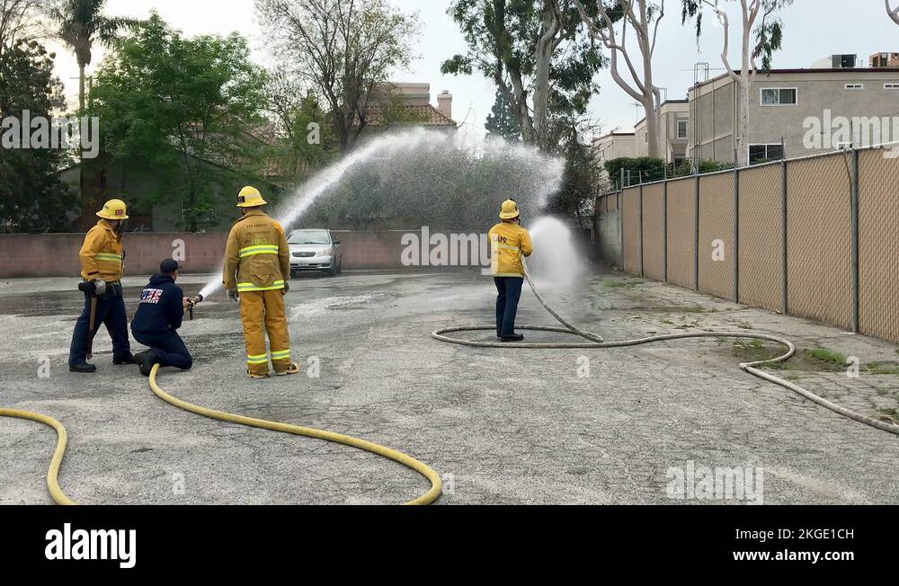 Instructor performing training exercises with firefighters in Los ...