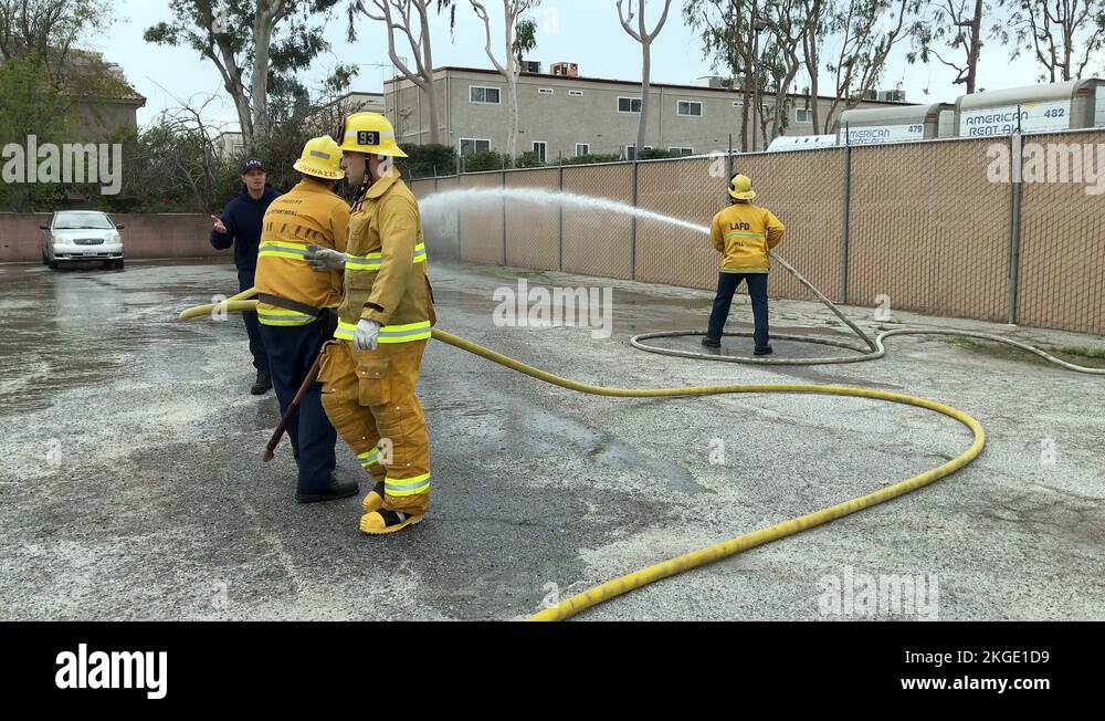 Instructor performing training exercises with firefighters in Los ...
