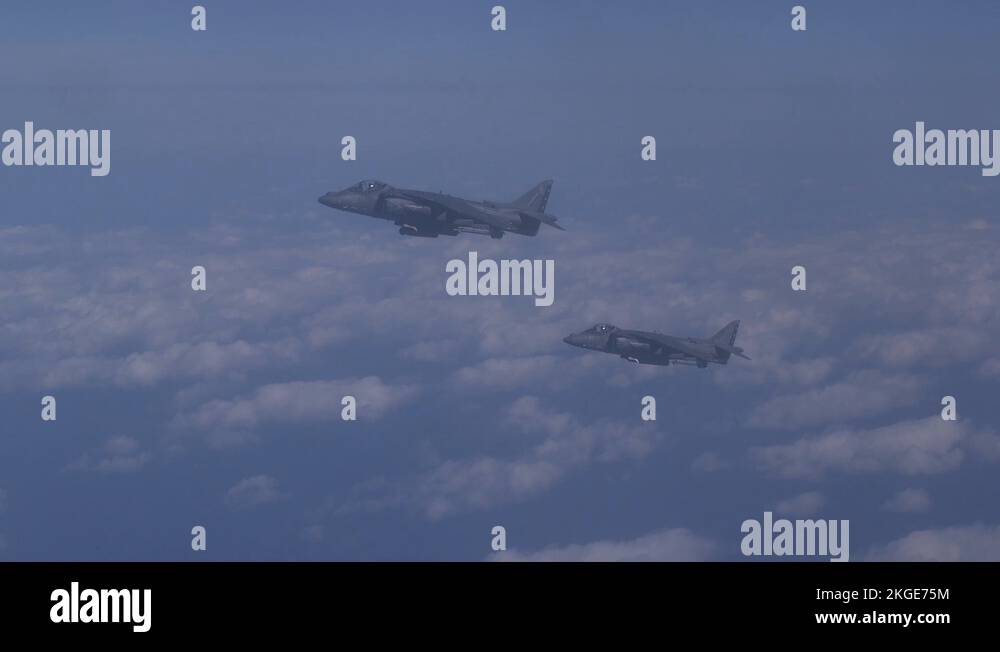 Harrier AV-8B flying in tandem above clouds Stock Video Footage - Alamy