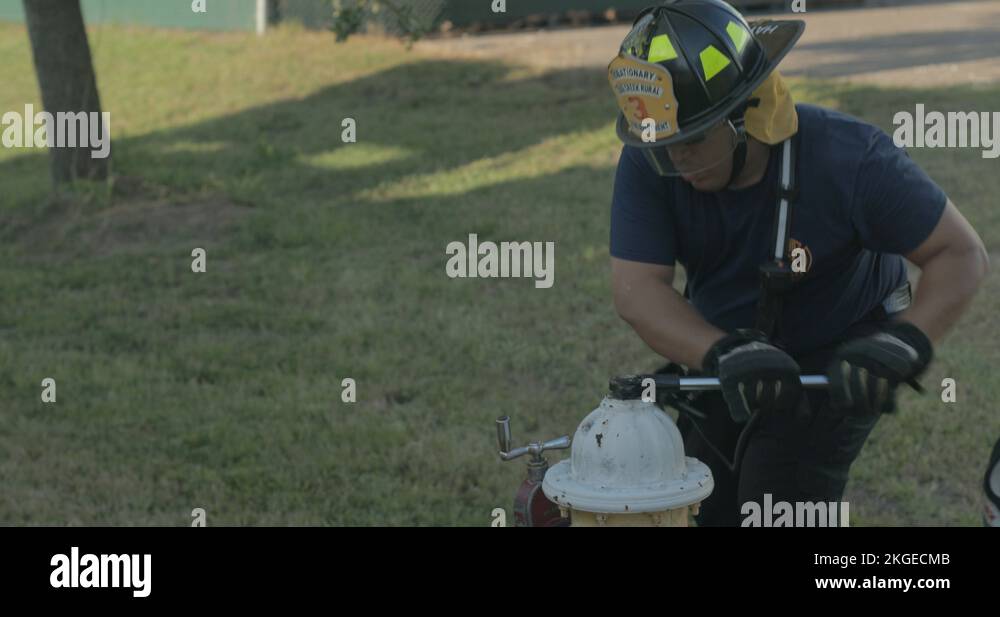 Firefighter opens hydrant during training Stock Video Footage - Alamy