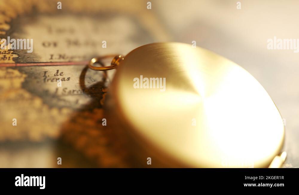 Old vintage compass lying on the ancient map. Used in sailing for ...