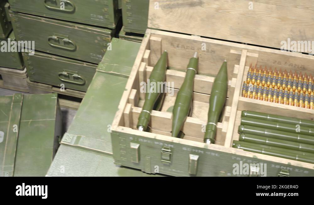 Huge stack of ammo boxes with RPG missiles and rifle ammunition in ...