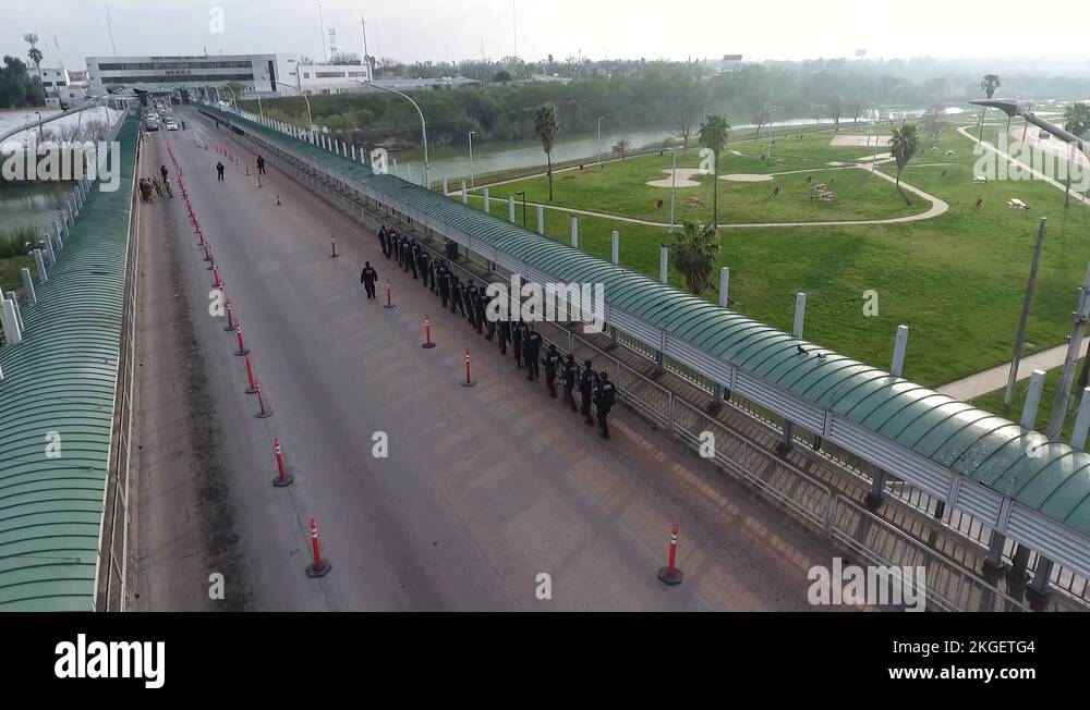 CBP officers walking with riot shields on Gateway to the Americas ...