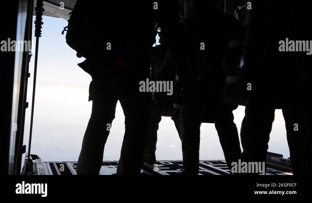 U.S. Marine paratroopers free fall from C-130 Hercules Stock Video ...