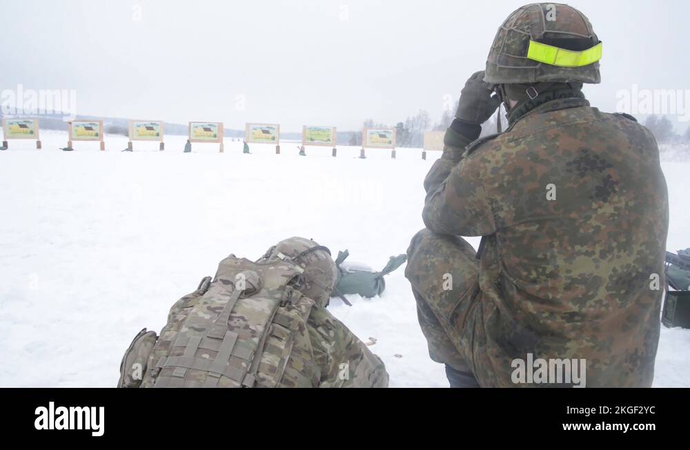 Soldier firing machine gun at target while lying on snow Stock Video ...