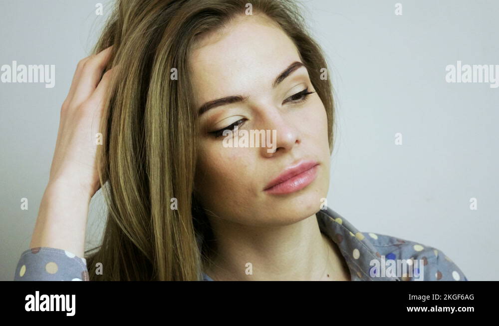 Portrait of beautiful young woman with a sad look and natural makeup ...
