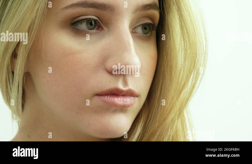 Portrait of beautiful young blonde woman with a sad look and natural ...