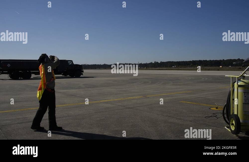 Aircraft marshaller signalling to pilot of F-16 Fighting Falcon Stock ...