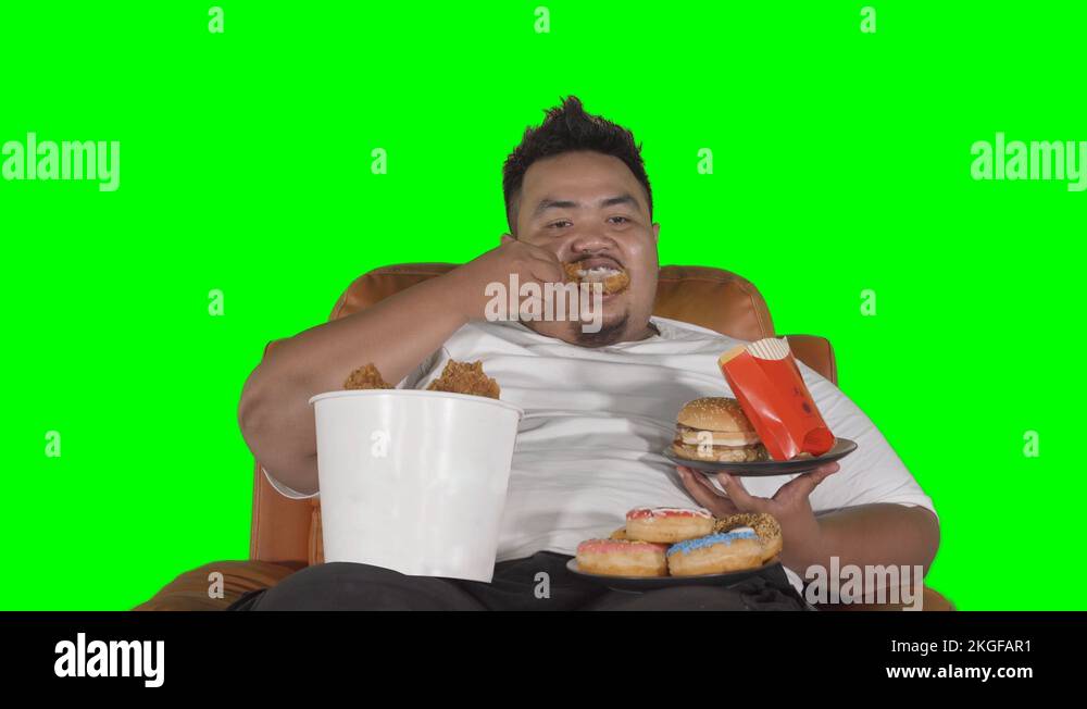 Greedy overweight man eating junk foods Stock Video Footage - Alamy