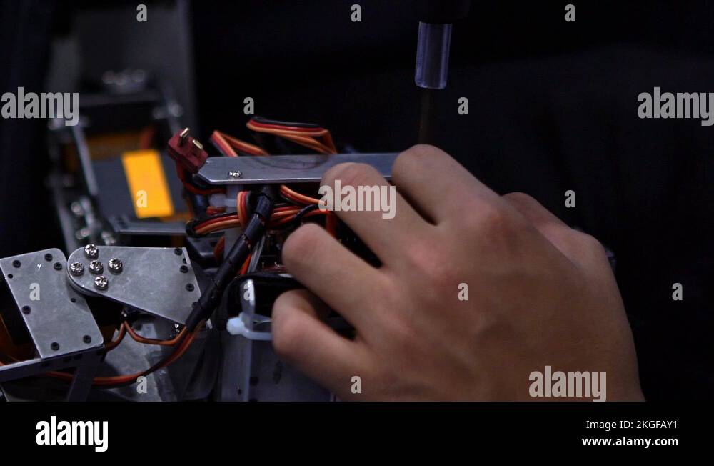 Slow Motion student prepare a remote control robot for competition ...