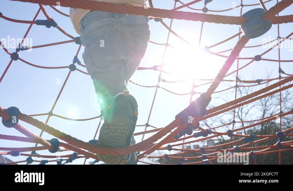 19 Rope web climbing and crawling little child girl on outdoors ...
