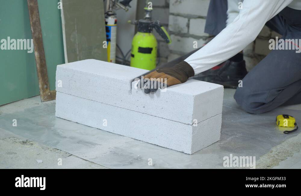 Builder sawing aerated concrete block Stock Videos & Footage - HD and ...